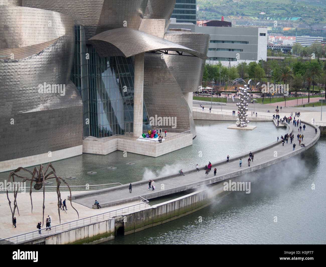 View of the Guggenheim Museum Bilbao bridge and public art by the ...