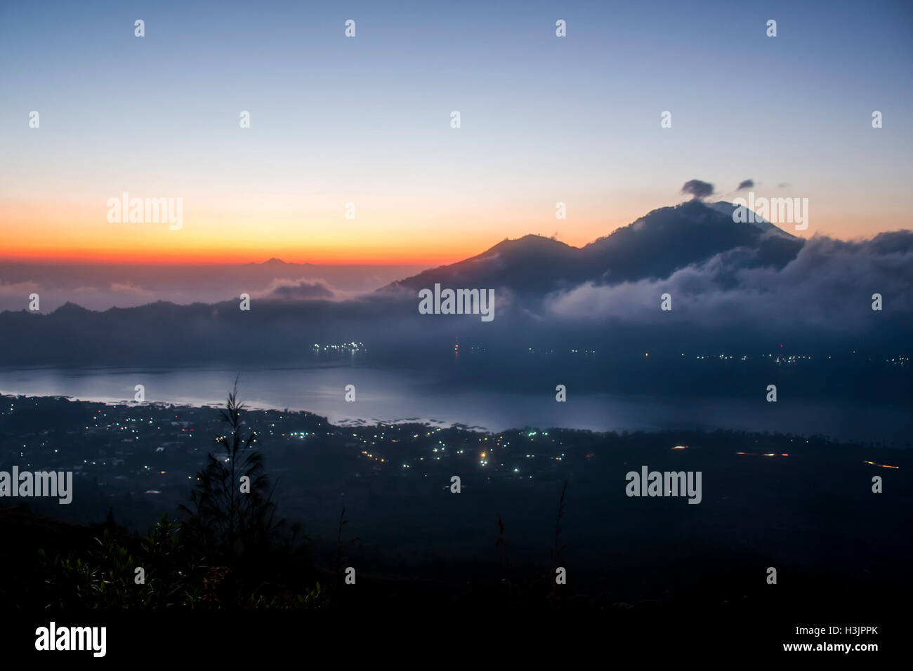 Bali Lake Batur volcano view sunset over Gunung Agung Stock Photo - Alamy