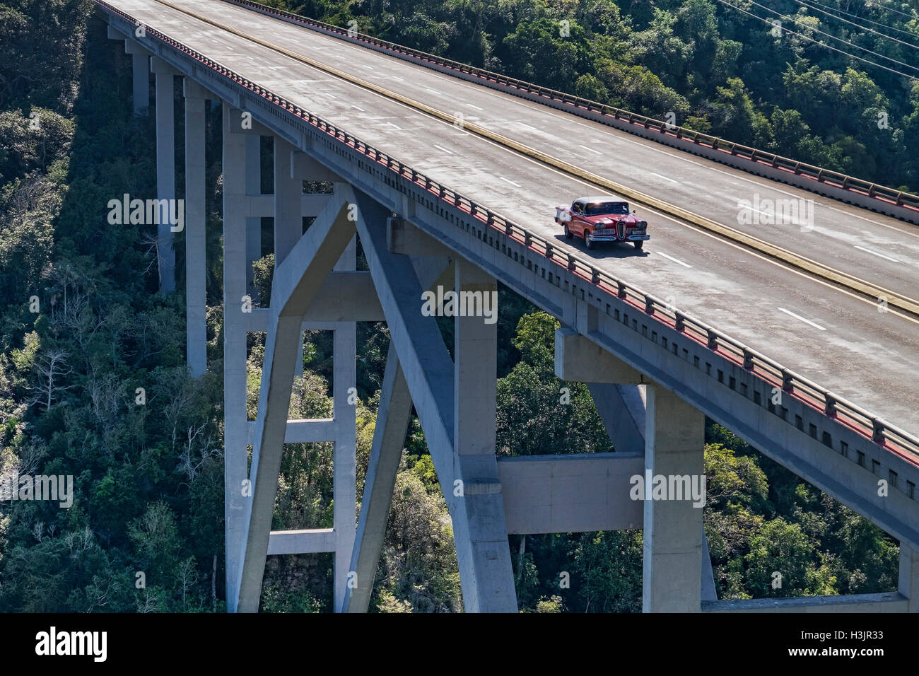 Red Cuban Car Crossing the famous Bacunayagua Bridge, Near Matanzas ...