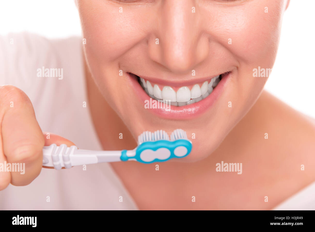 Brushing teeth. Woman actually brushing her teeth with toothpaste Stock ...
