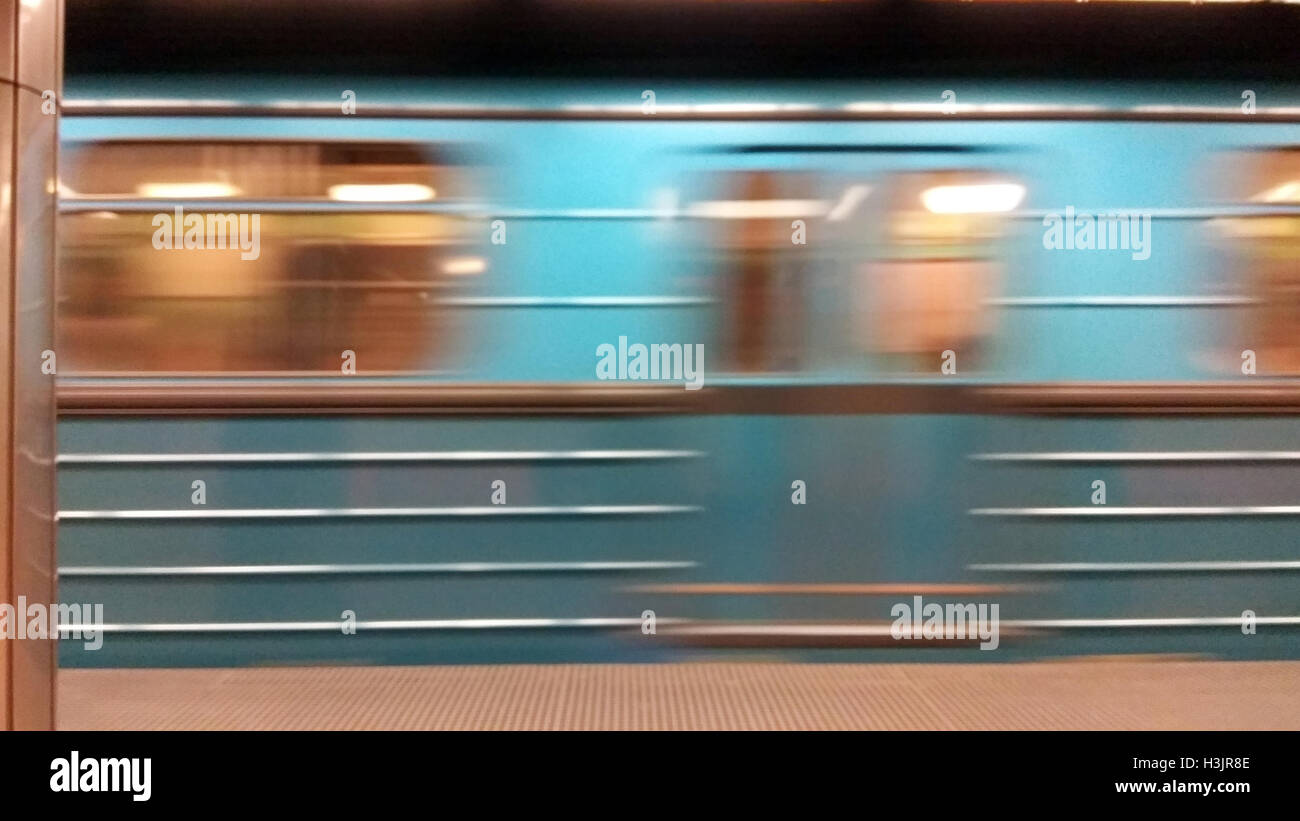 Rapid metro train moving across empty station Stock Photo - Alamy