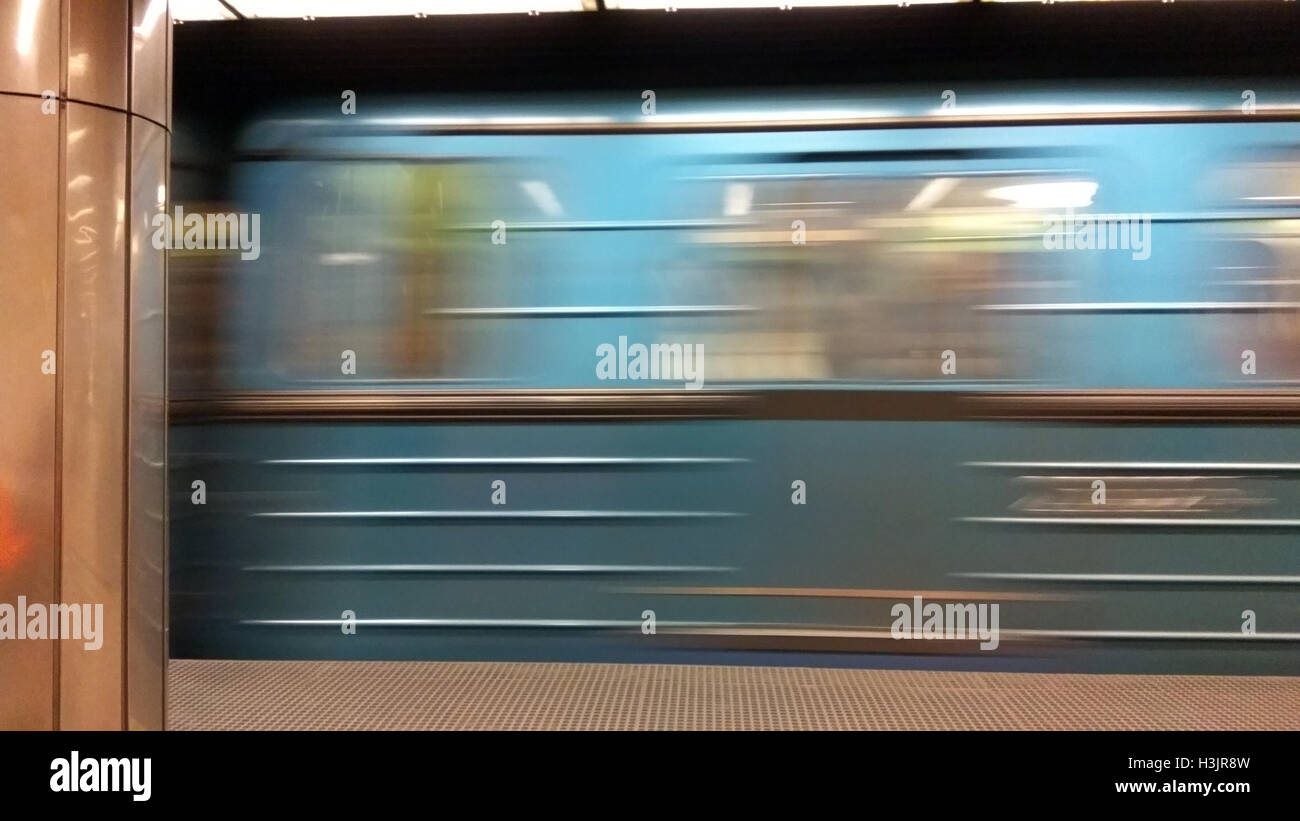 Subway train fast moving at metro station Stock Photo - Alamy
