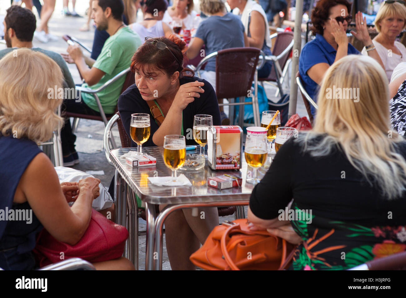 Group Of People Smoking Cigarettes