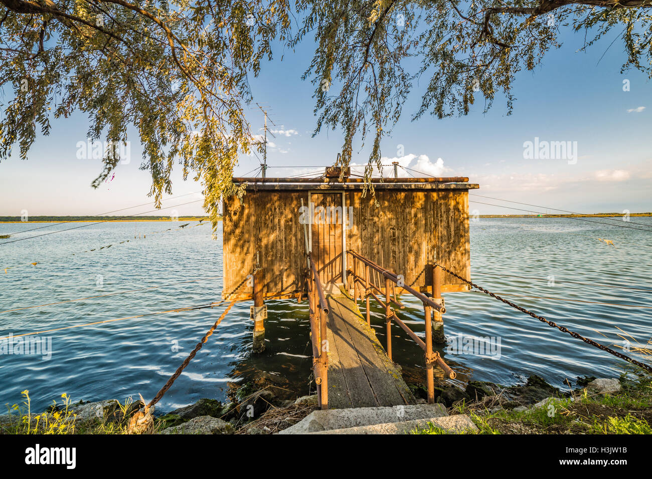 Traditional Fishing European Hut in sea lagoon Stock Photo - Alamy