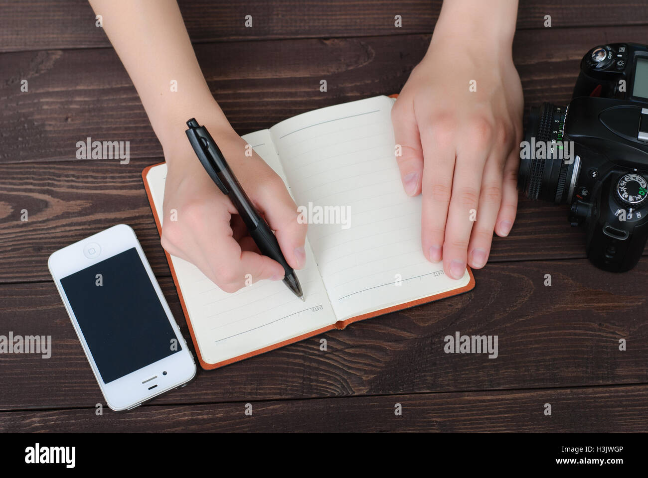 Top view of a hands with pen and notepad Stock Photo - Alamy