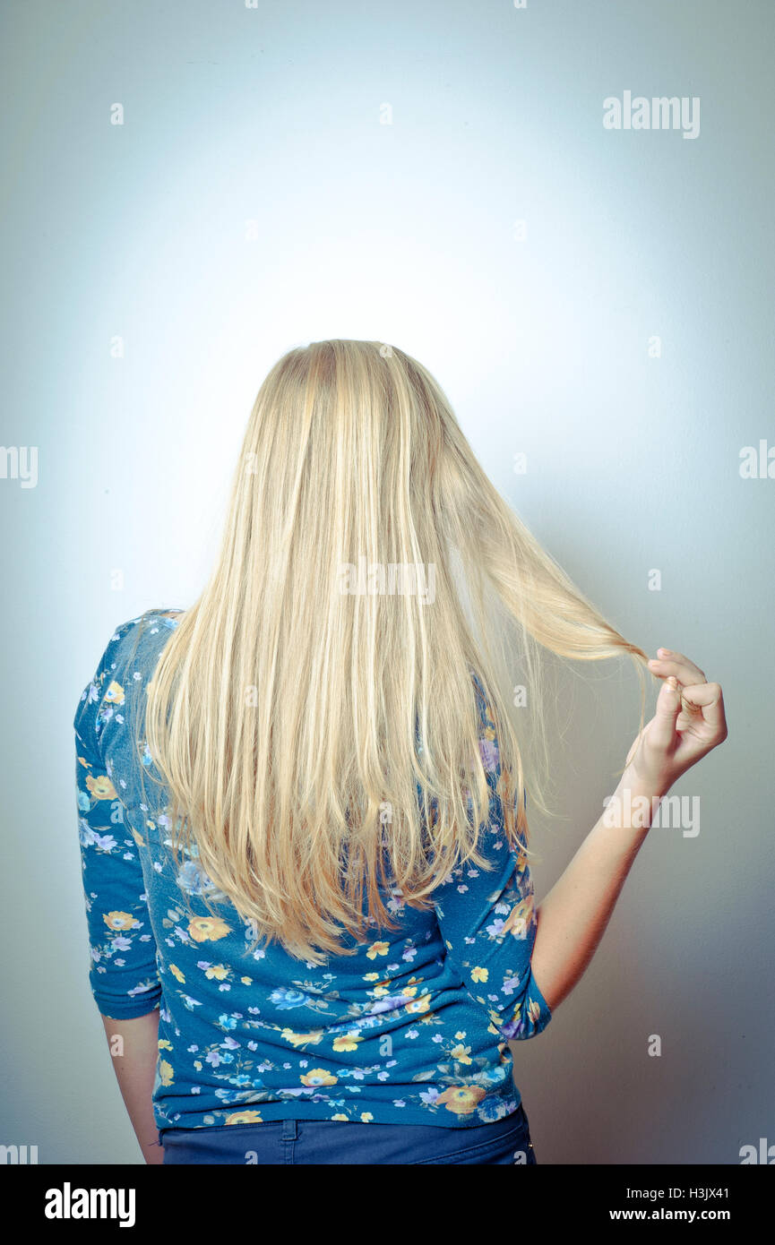 Woman touching hair hi-res stock photography and images - Alamy