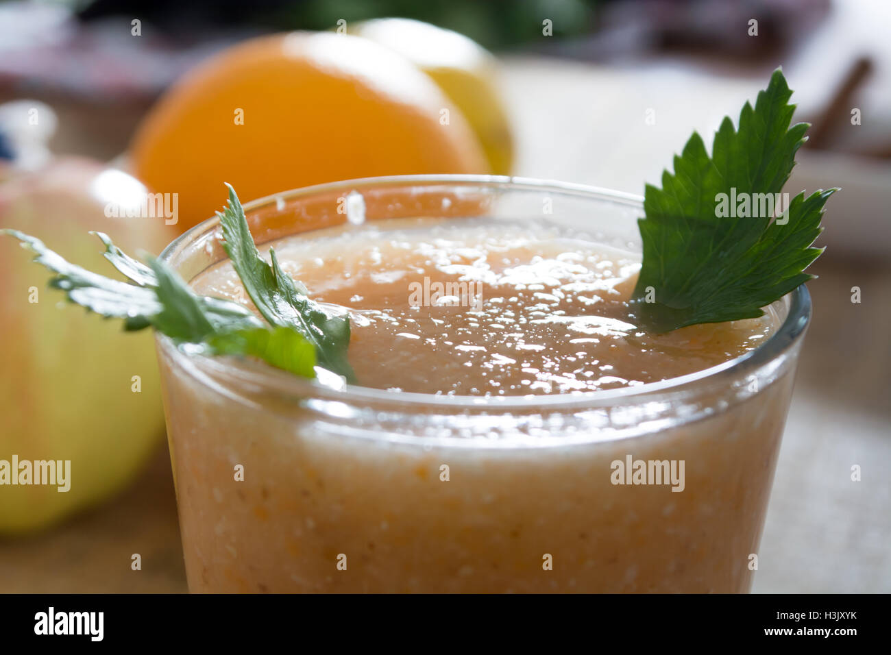 Fresh lemonade with ginger served on a table full with other fruits and ...