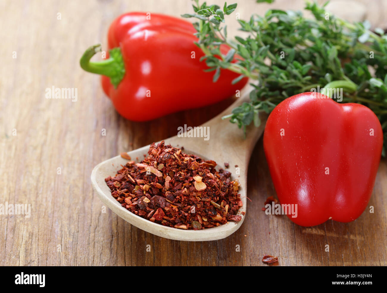 Grinded sweet paprika in a wooden spoon Stock Photo - Alamy