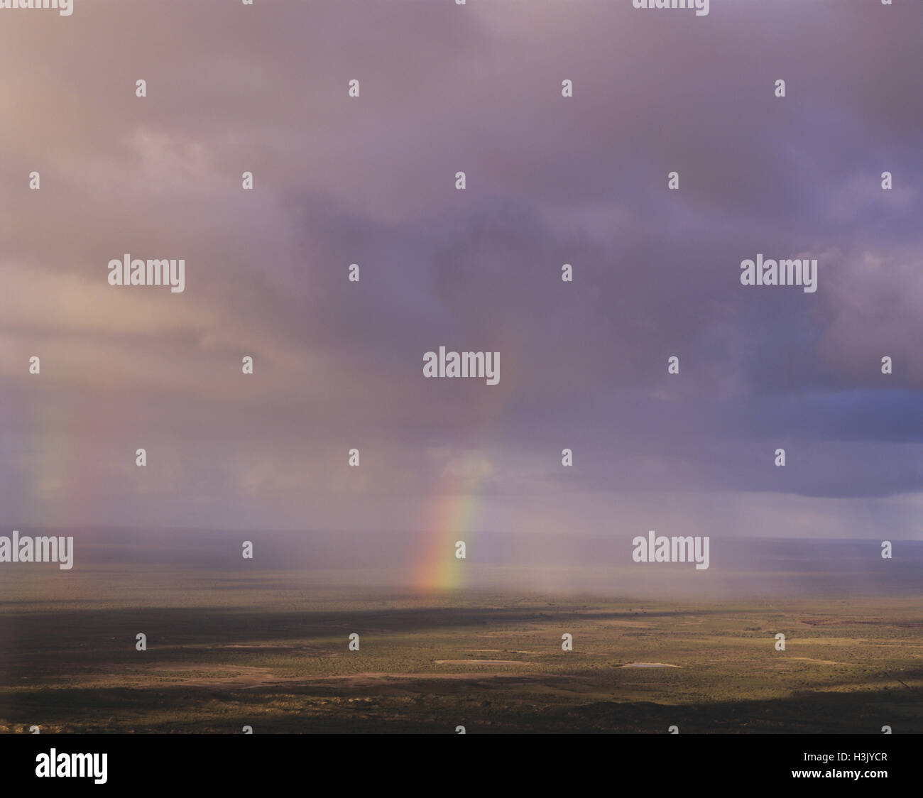 Rainbow and rain over Southern Ocean Stock Photo - Alamy