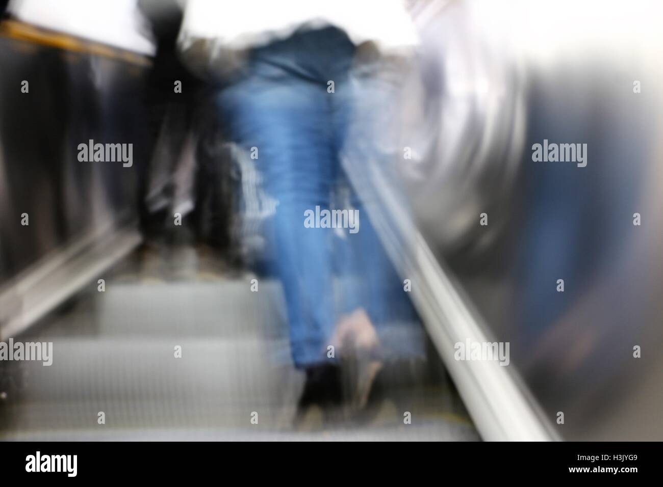 Defocused subway station escalator scene Stock Photo - Alamy