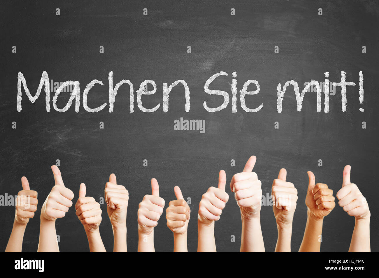Chalkboard with german slogan "Machen Sie mit" (Join us) and many ...