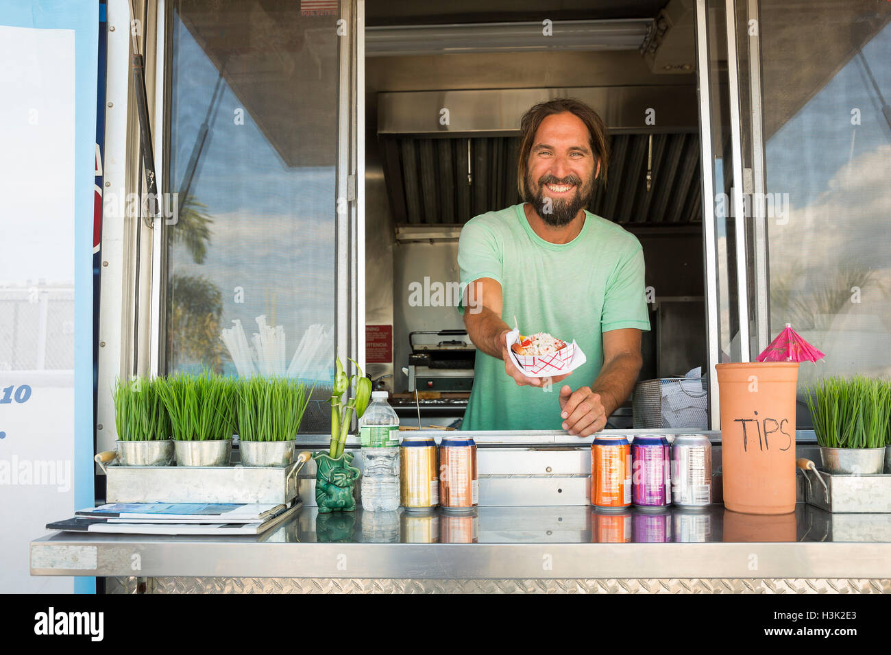 Portrait of man in fast food trailer Stock Photo - Alamy