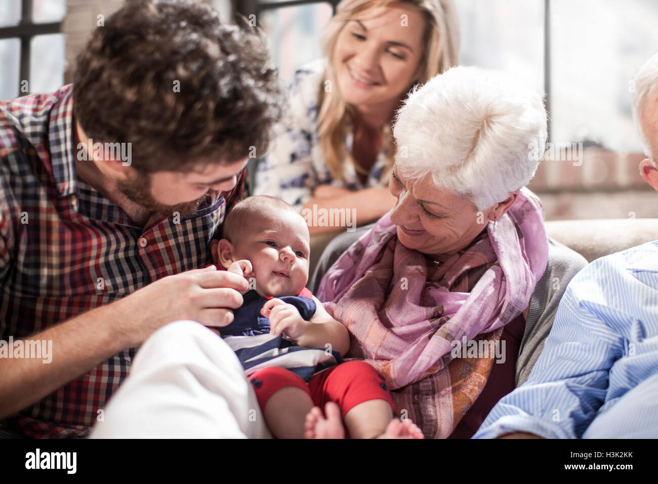 Happy three generation family at home Stock Photo - Alamy