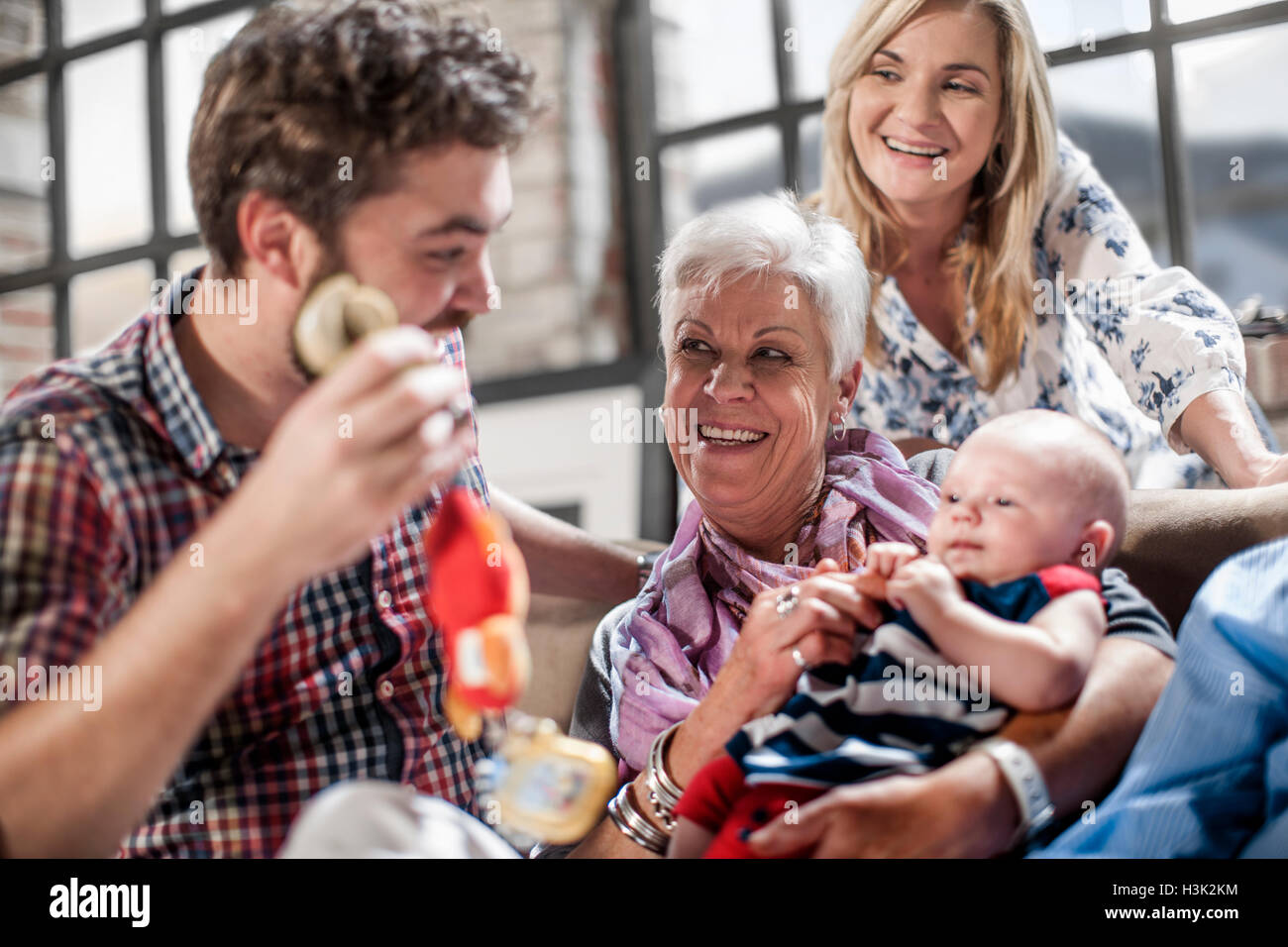 Happy three generation family at home Stock Photo - Alamy