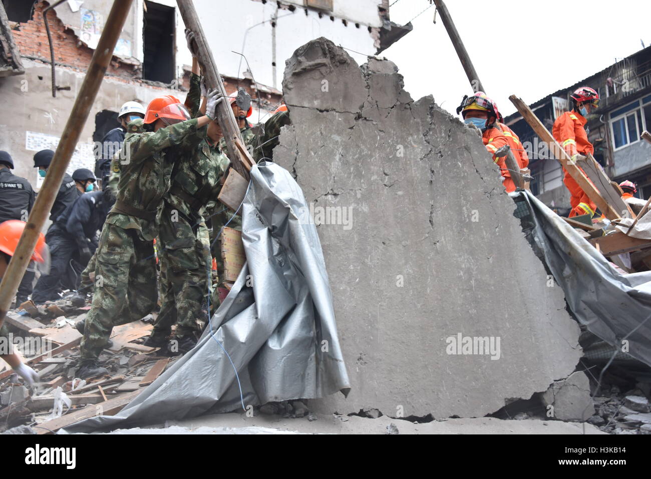 Wenzhou. 10th Oct, 2016. Rescuers work at the accident site after ...