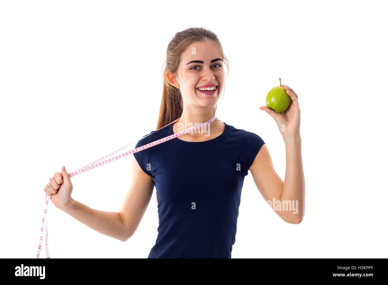 Woman with centimeter holding an apple Stock Photo - Alamy