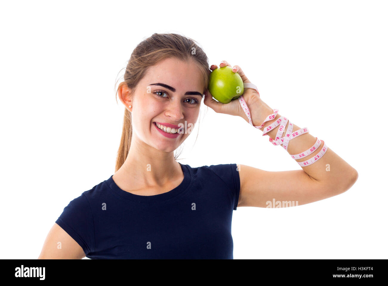 Woman with centimeter holding an apple Stock Photo - Alamy
