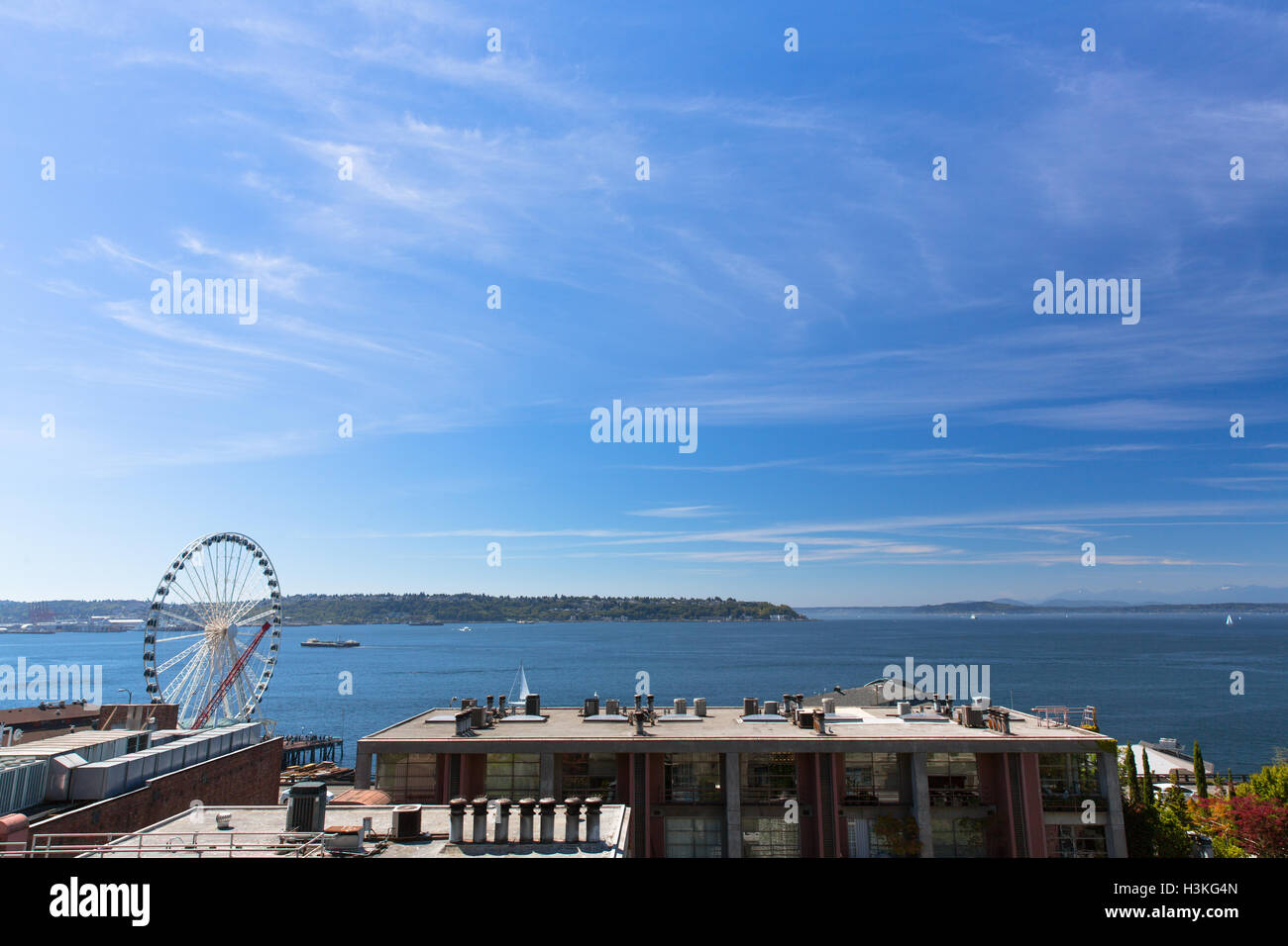 Looking out over the Puget Sound with Ferris wheel - Seattle, WA Stock ...