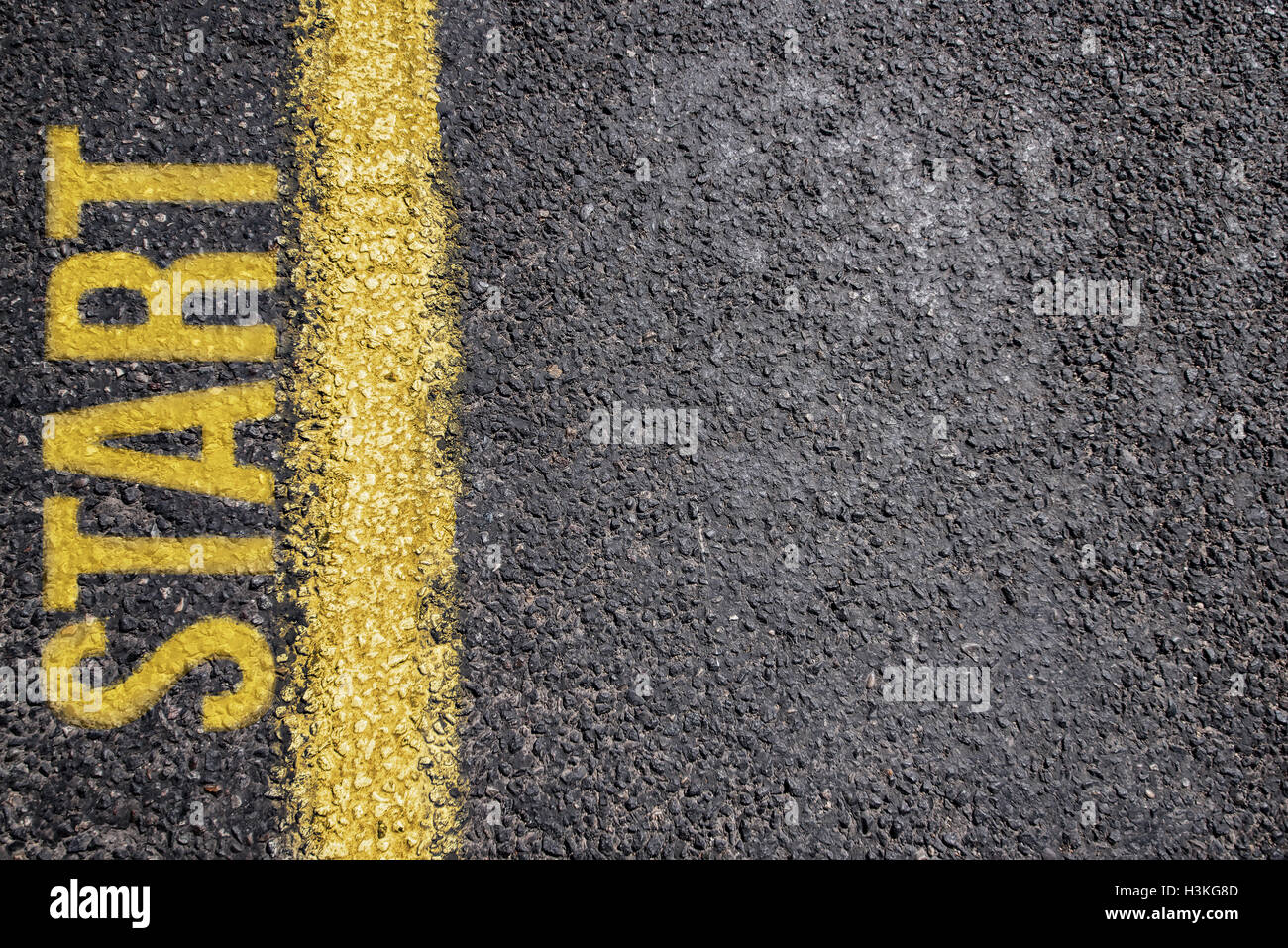 Word Start written on an asphalt road background Stock Photo - Alamy