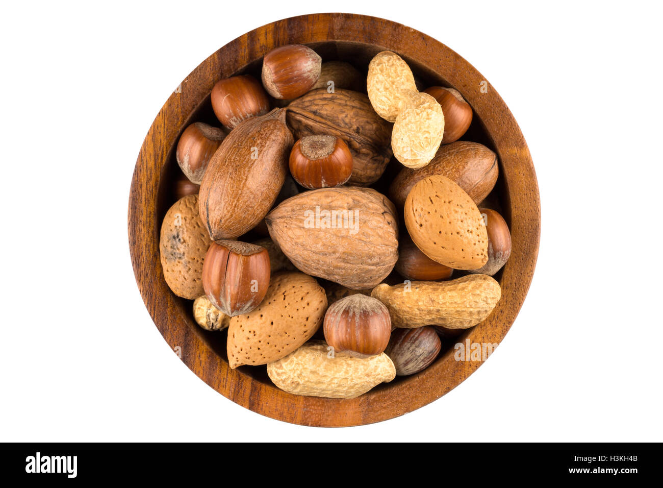 Mixed nuts in shells in a bowl a white background Stock Photo - Alamy