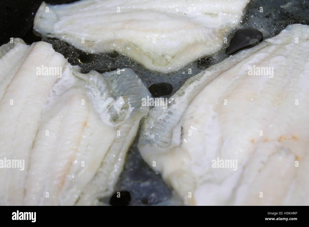 fillets of plaice in cooking in a pan Stock Photo - Alamy