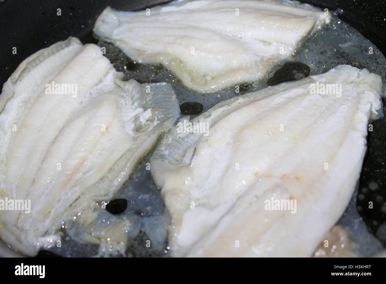 fillets of plaice in cooking in a pan Stock Photo - Alamy