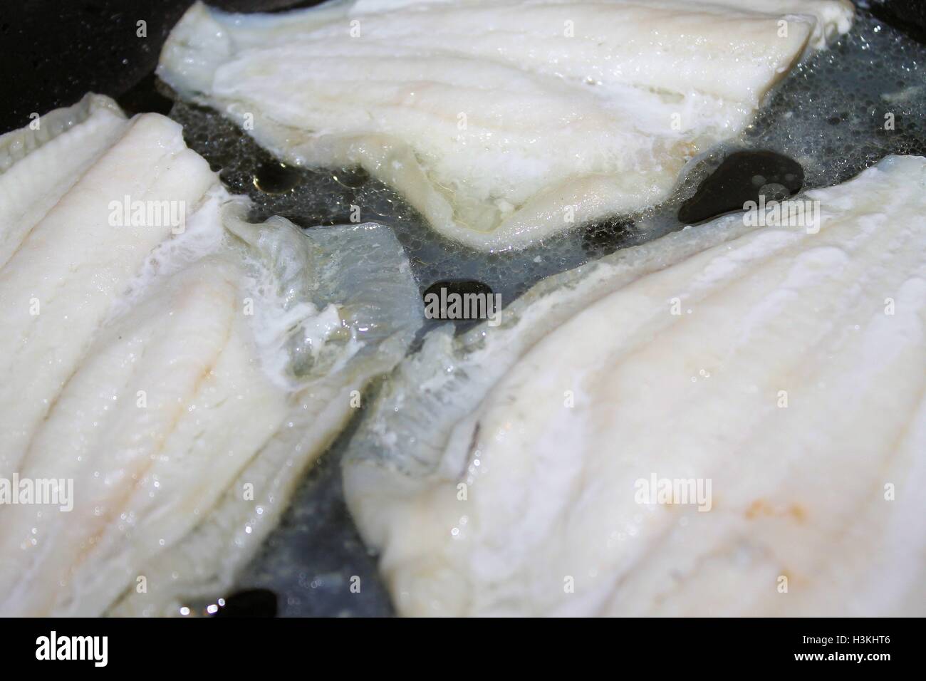 fillets of plaice in cooking in a pan Stock Photo - Alamy