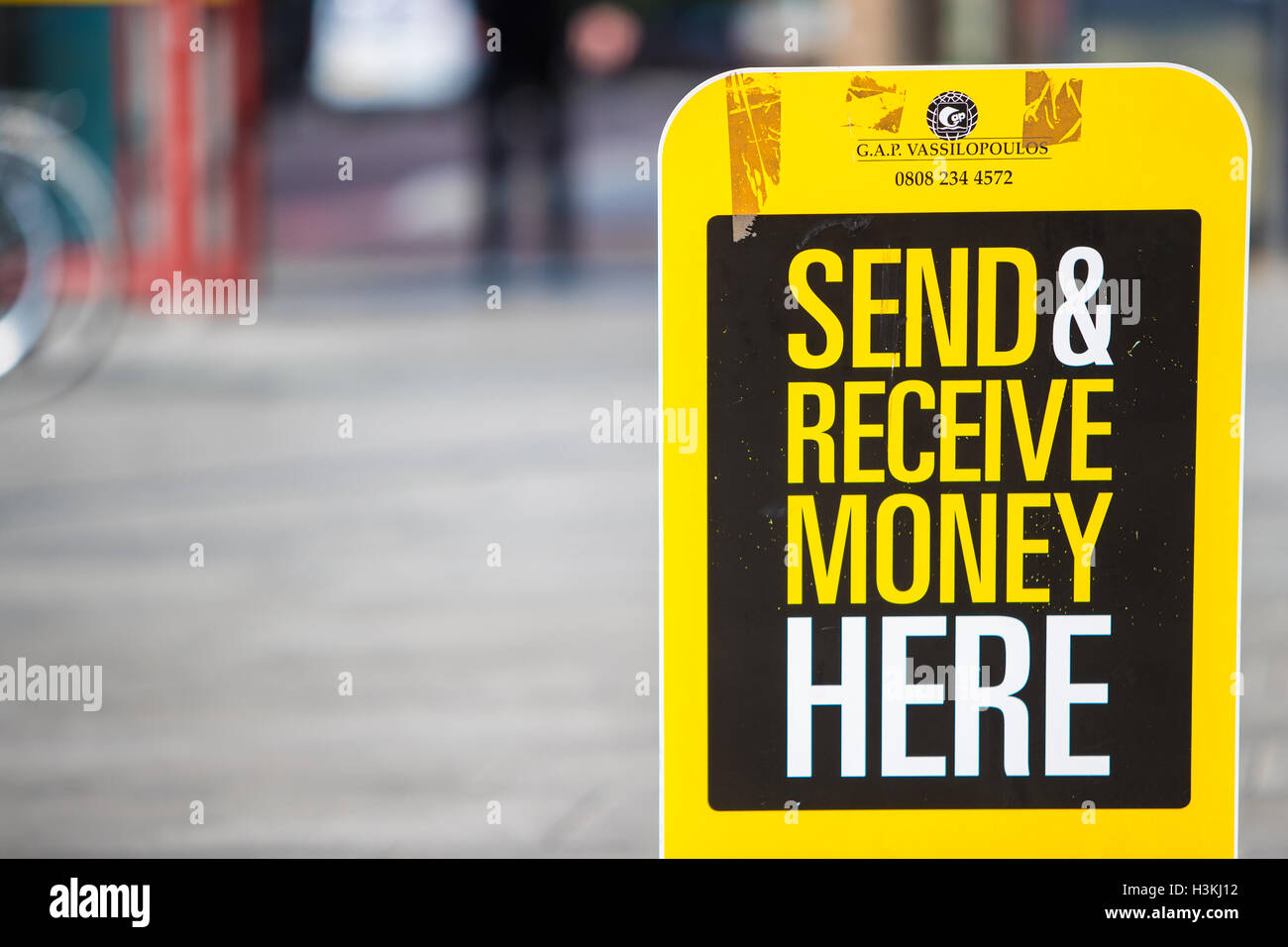 Send and receive money sign on an east london high street. broken ...