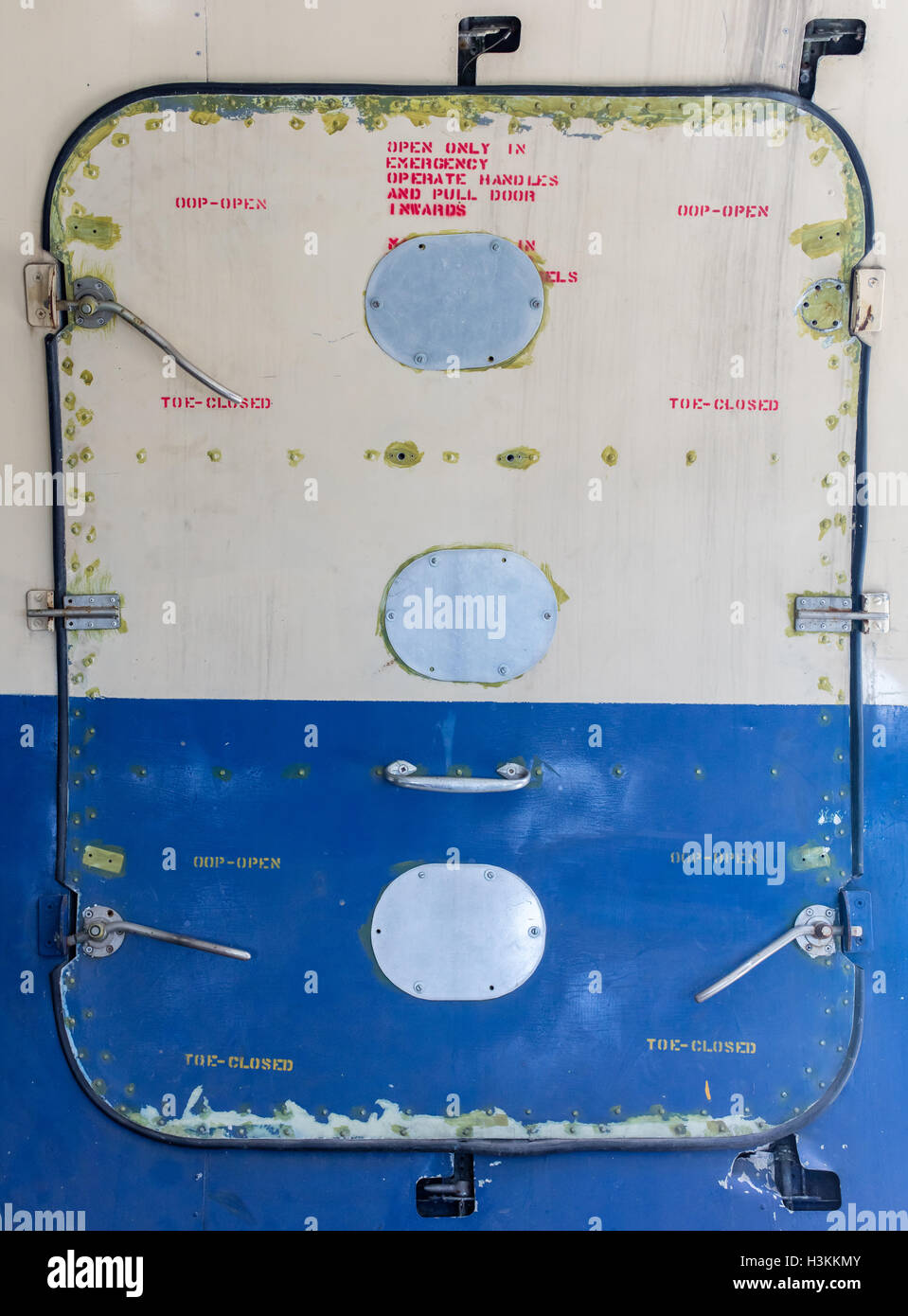 Emergency exit door in an old airplane Stock Photo - Alamy