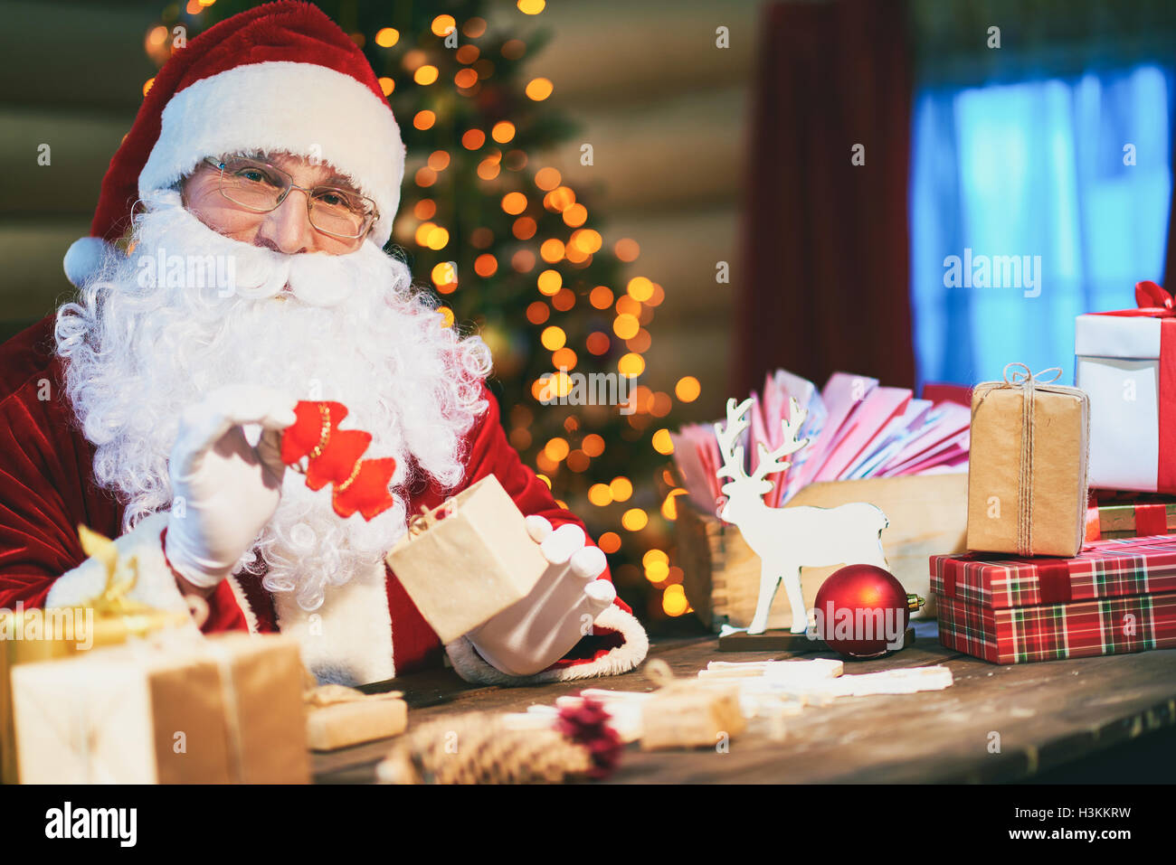 Santa claus packaging gifts hi-res stock photography and images - Alamy