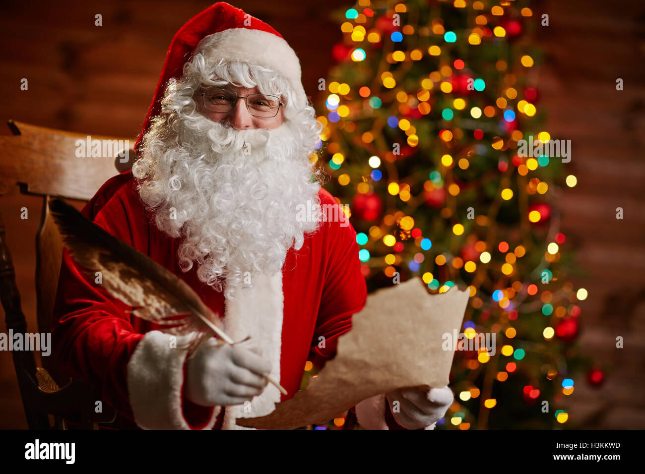 Santa Claus writing message Stock Photo - Alamy