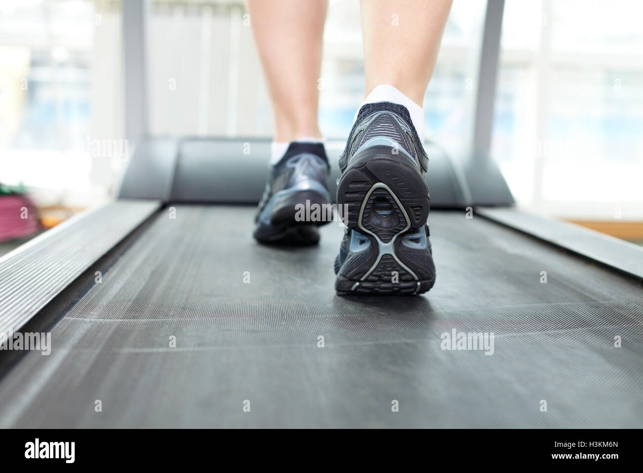 Feet on treadmill Stock Photo - Alamy
