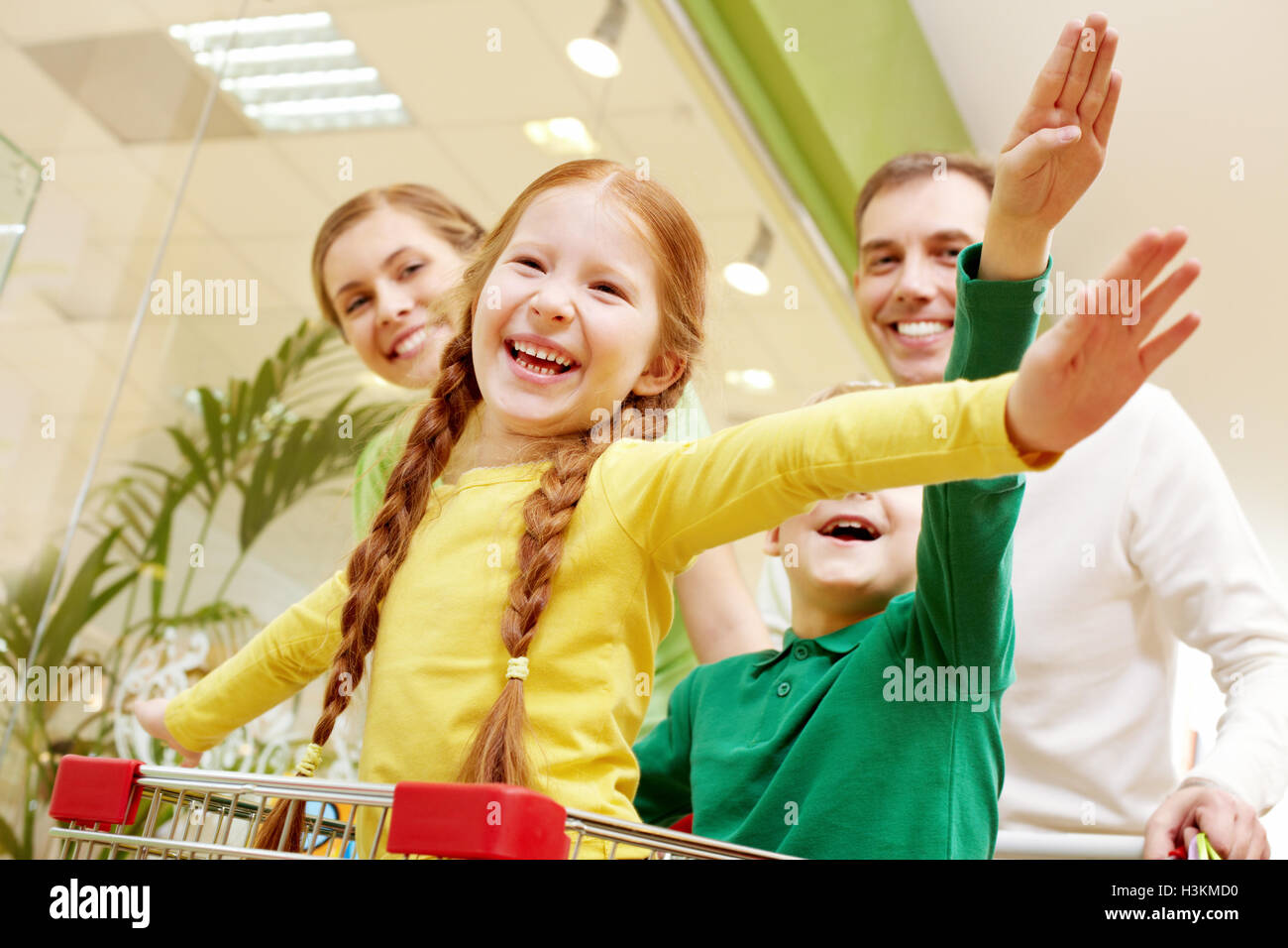 Children sitting in shopping cart hi-res stock photography and images ...