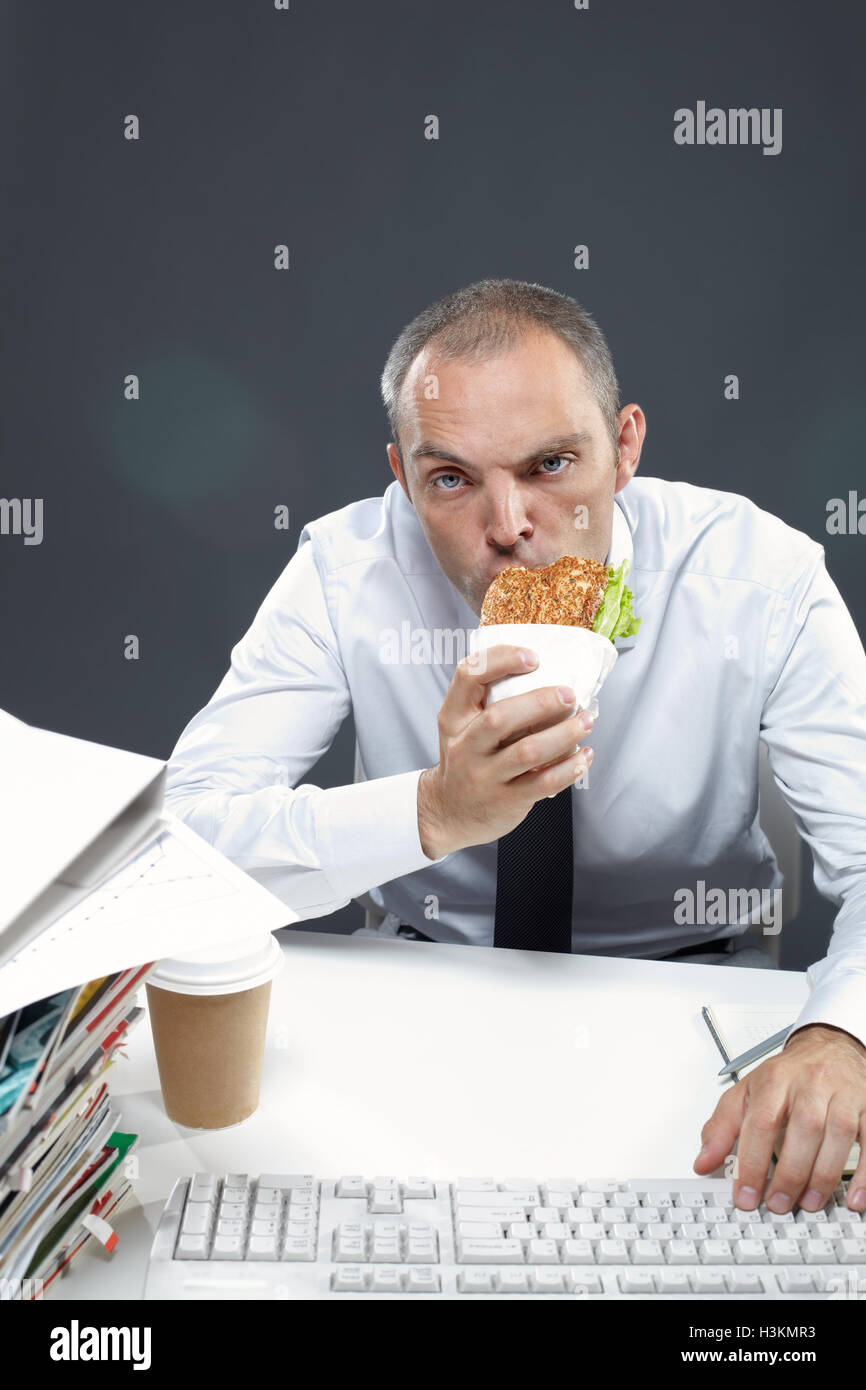 Snack at workplace Stock Photo - Alamy