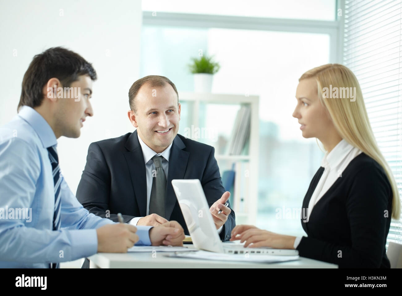 Employees at discussion Stock Photo - Alamy