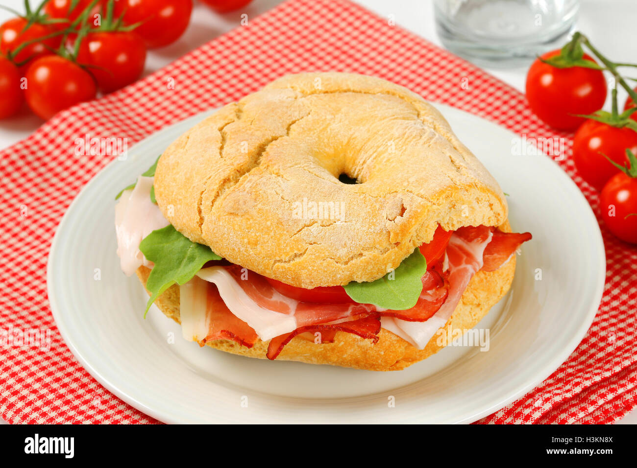 Ring-shaped bread roll with slices of prosciutto Stock Photo - Alamy