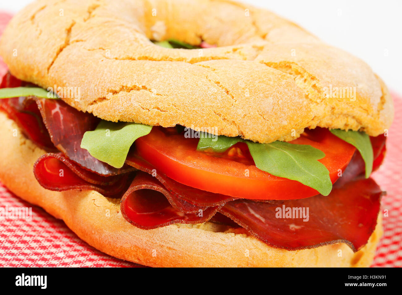 Friselle bread with thin slices of smoked beef Stock Photo - Alamy
