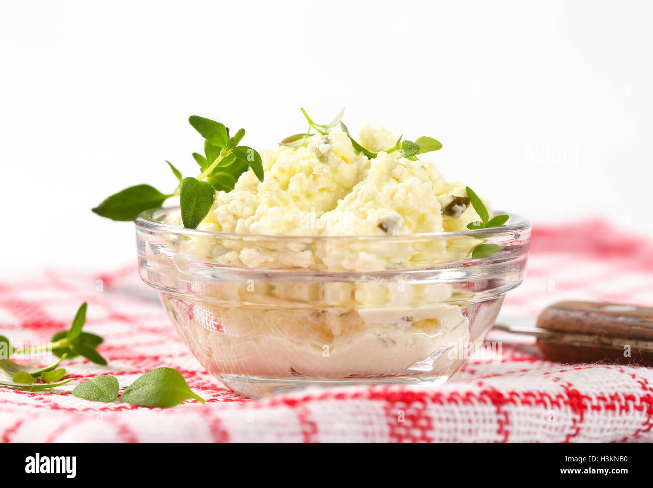 close up of homemade cheese spread with herbs in glass bowl Stock Photo ...