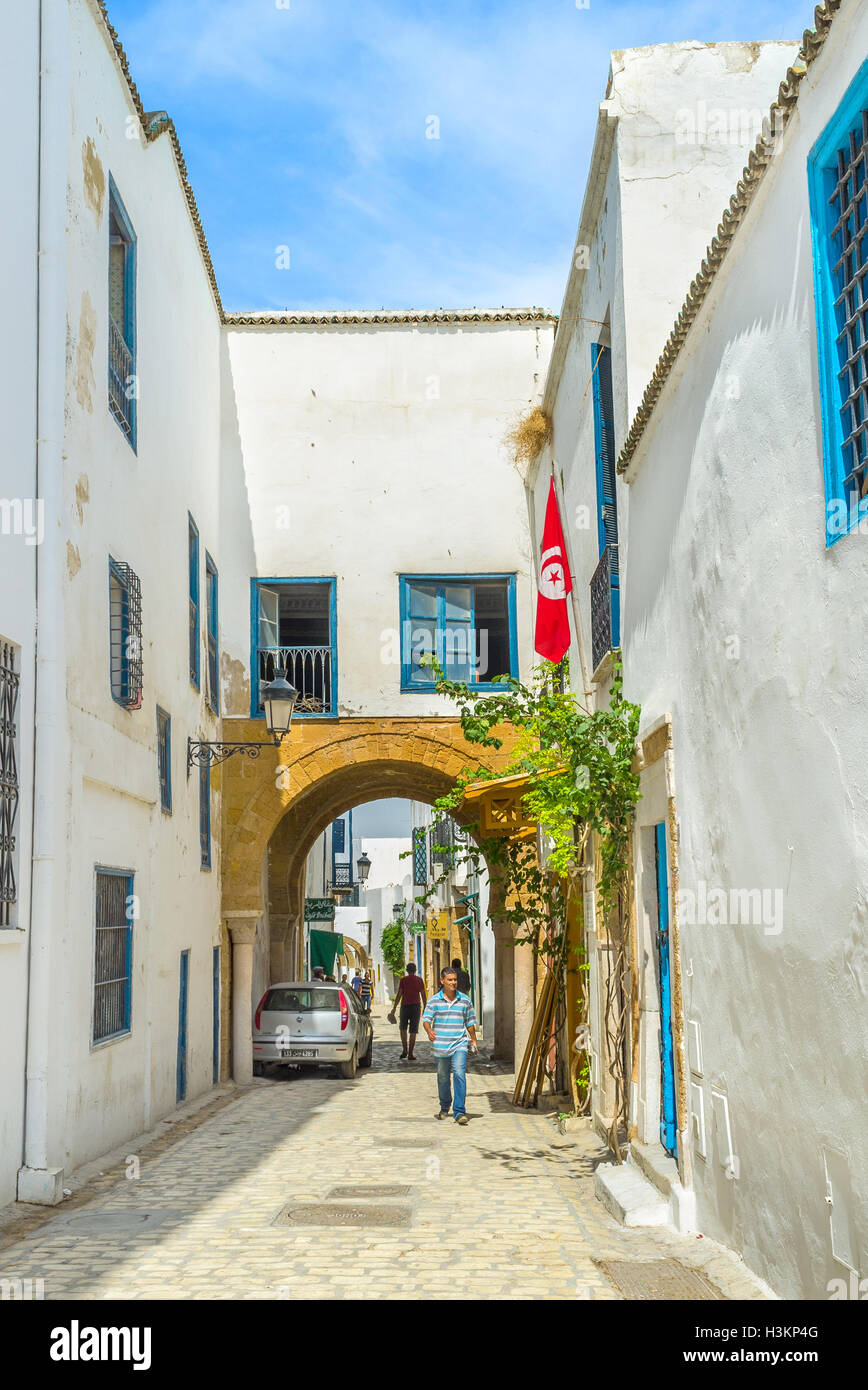 The street of Medina with the stone passage and medieval house in Tunis ...