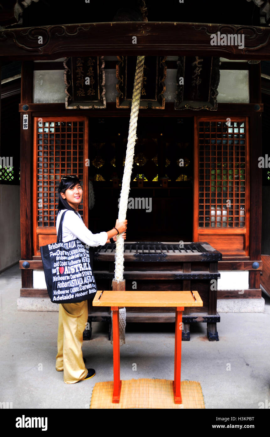 Traveler thai women shaking bell ceremony or merit for pray at small ...