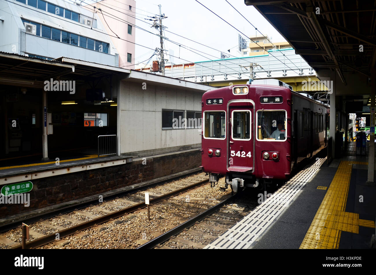 Red classic train of Hankyu kyoto line running from Kyoto station go to ...