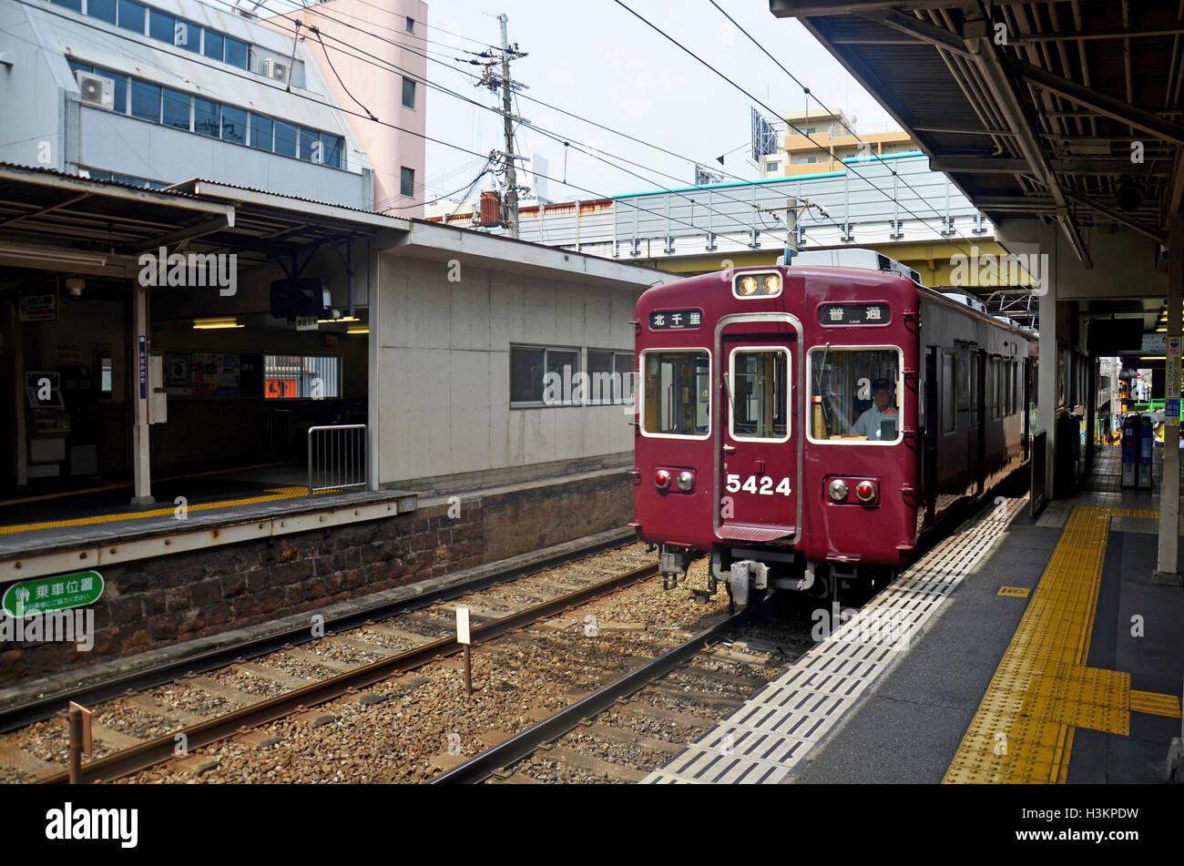 Red classic train of Hankyu kyoto line running from Kyoto station go to ...