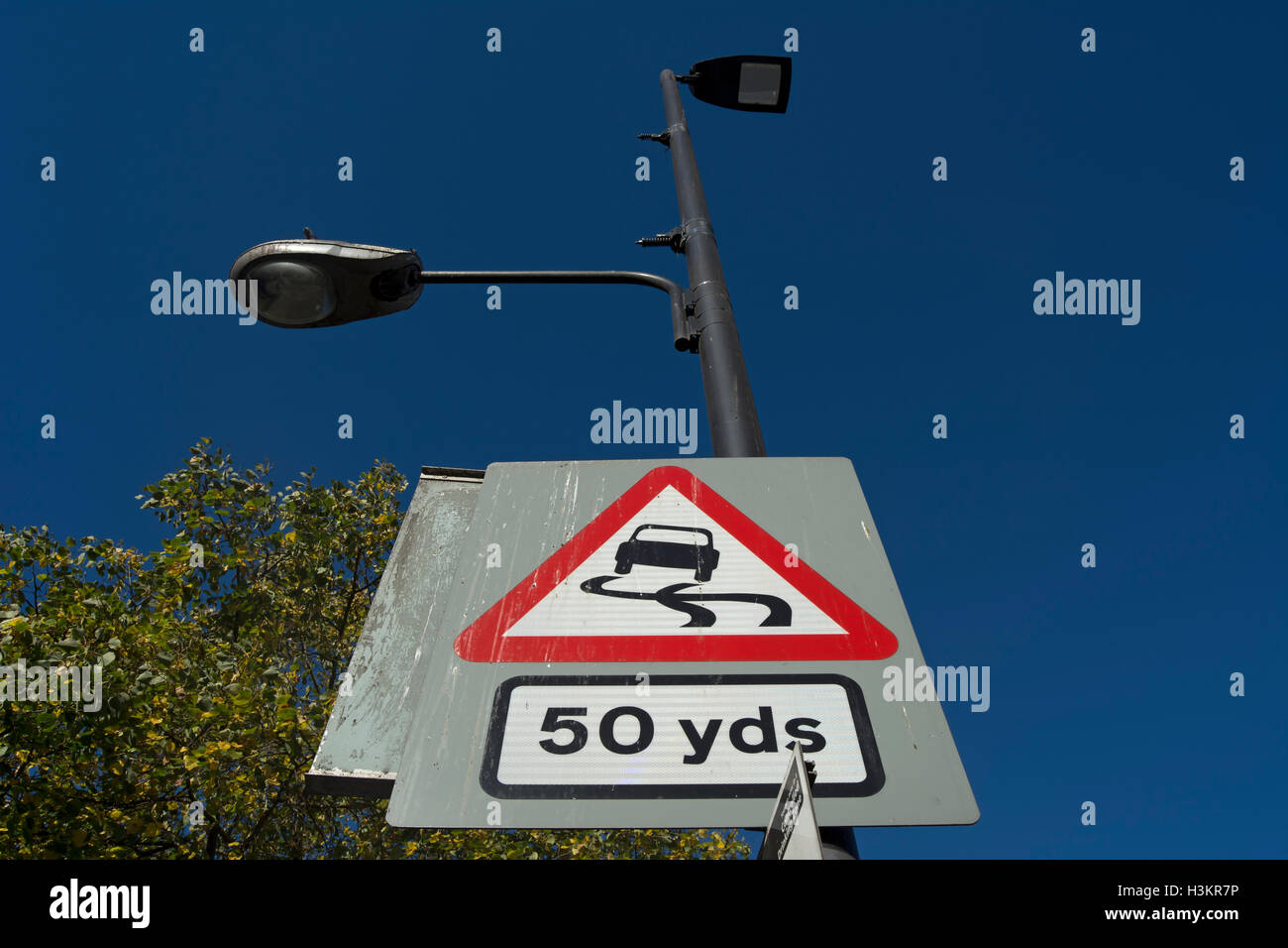 Slippery road sign hi-res stock photography and images - Alamy