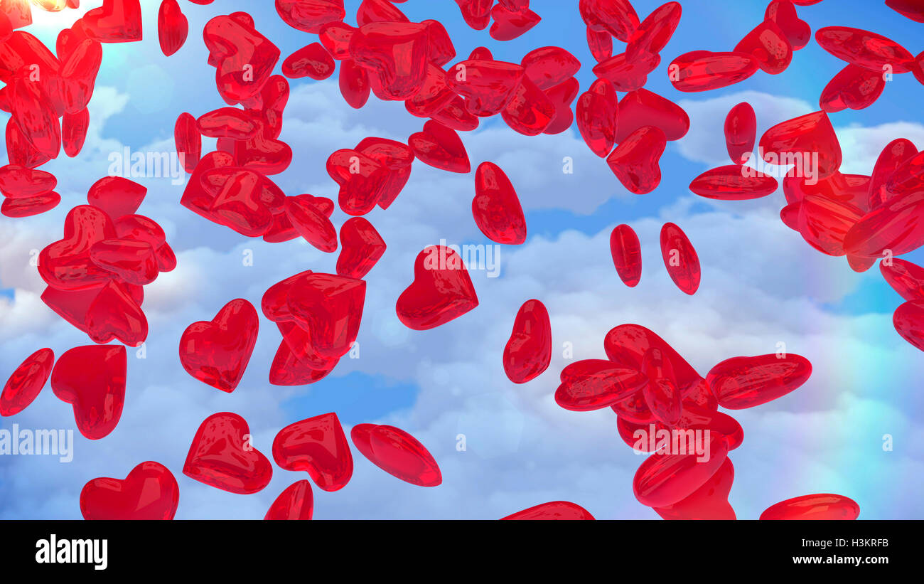 Falling hearts on blue cloudy sky background Stock Photo - Alamy