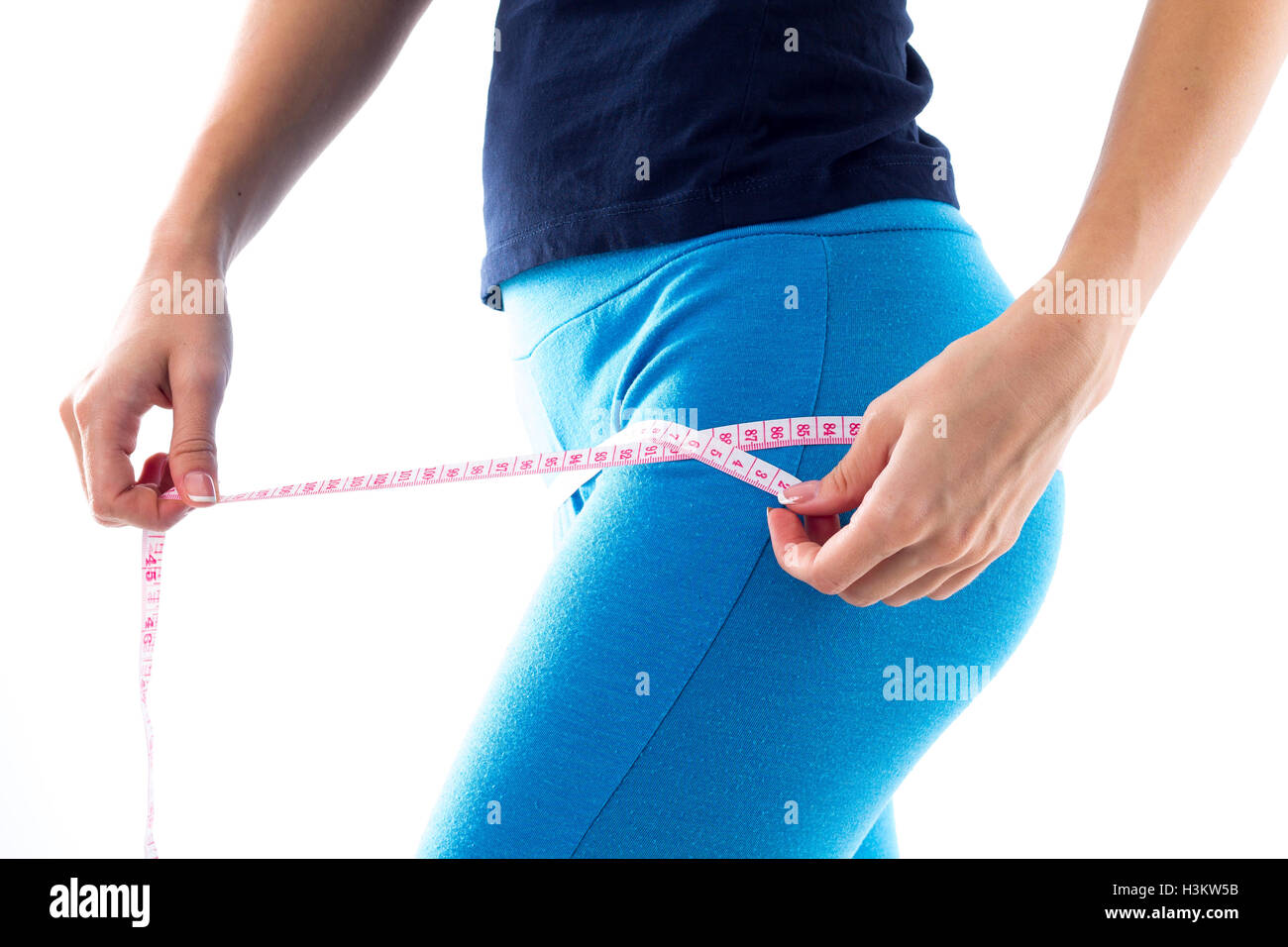 Woman measuring her buttocks Stock Photo - Alamy