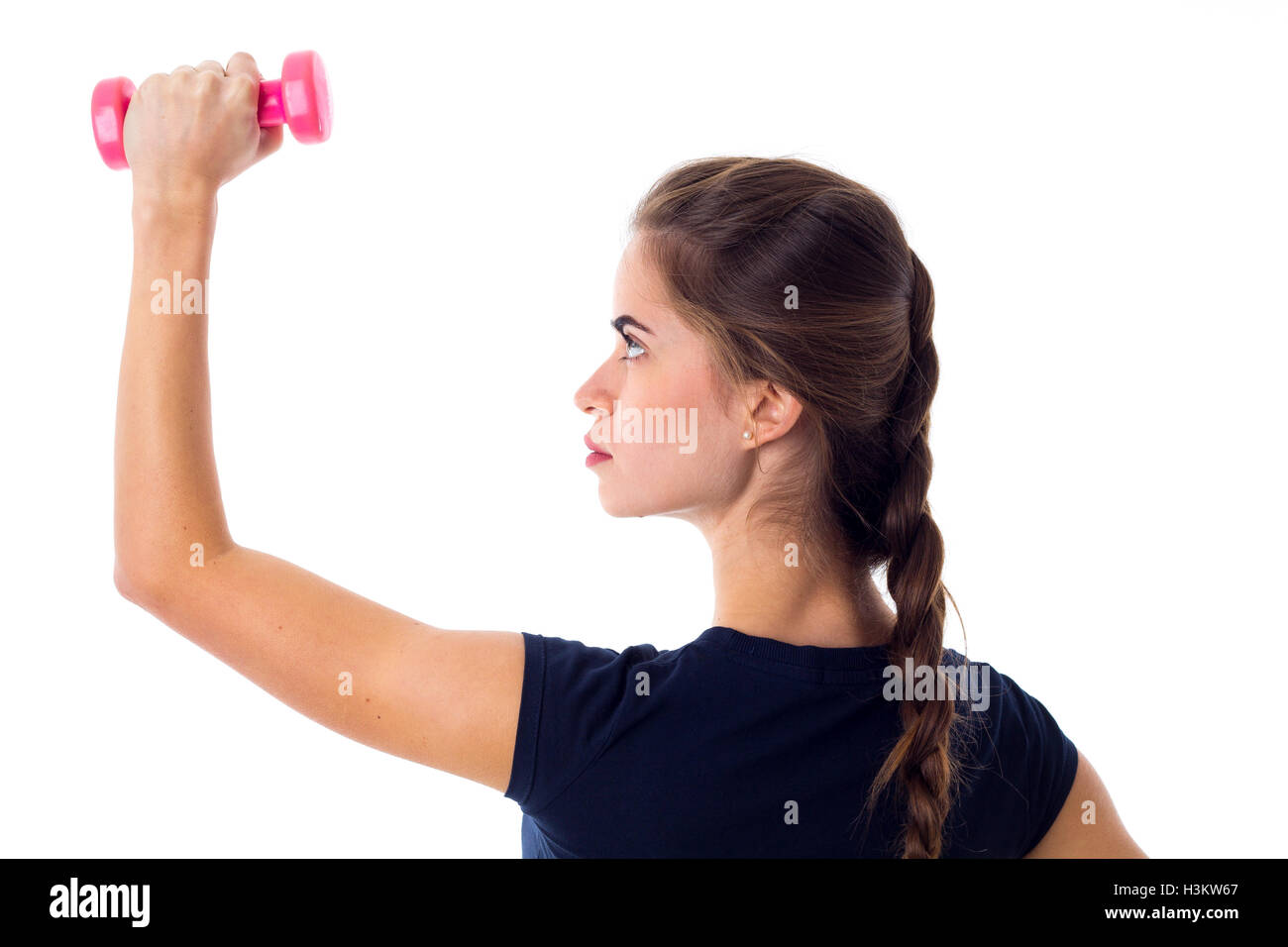 Woman holding a pink dumbbell Stock Photo - Alamy
