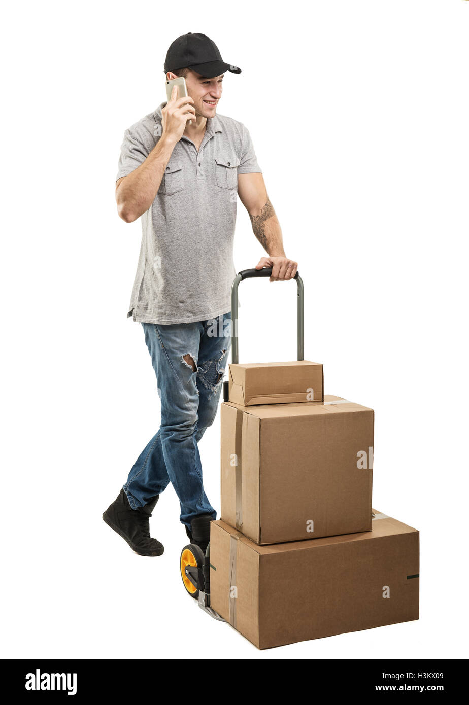 During a call - Courier hand truck boxes and packages Stock Photo - Alamy