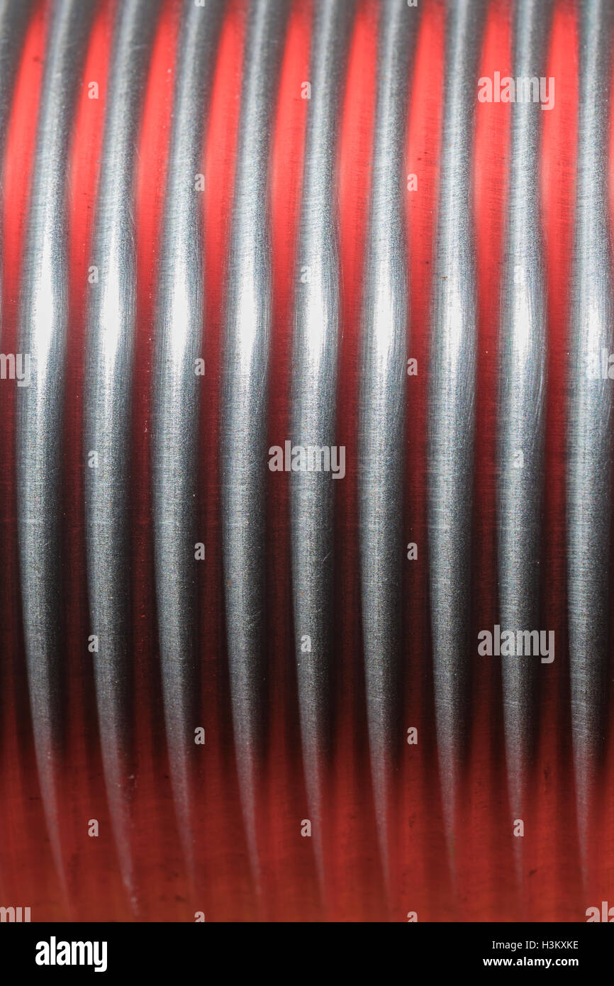 Abstract macro-photo of baked bean can strengthening ribs - lit by ...