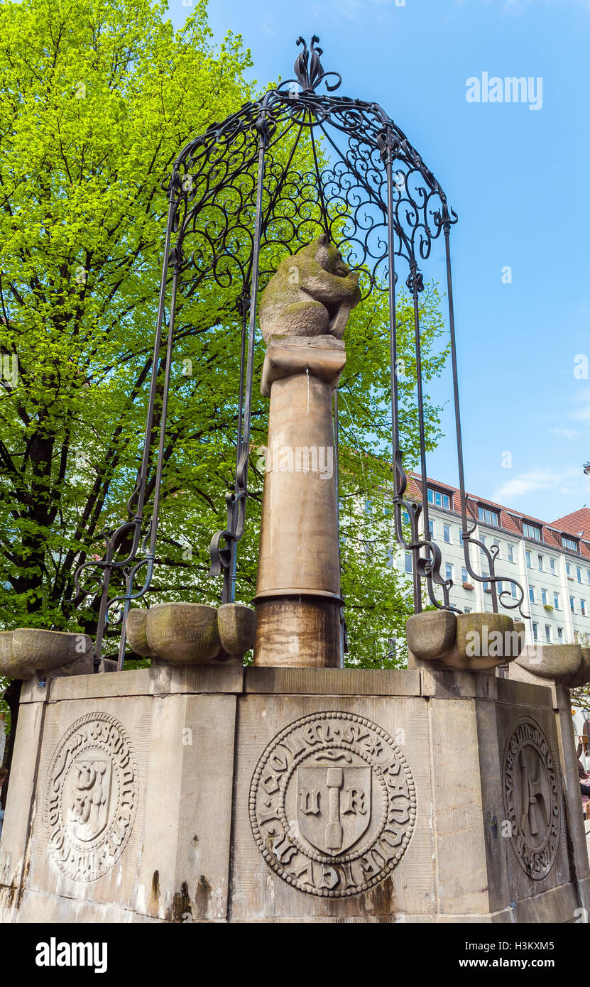 The fountain with the bear and the medieval coats of arms in the centre ...