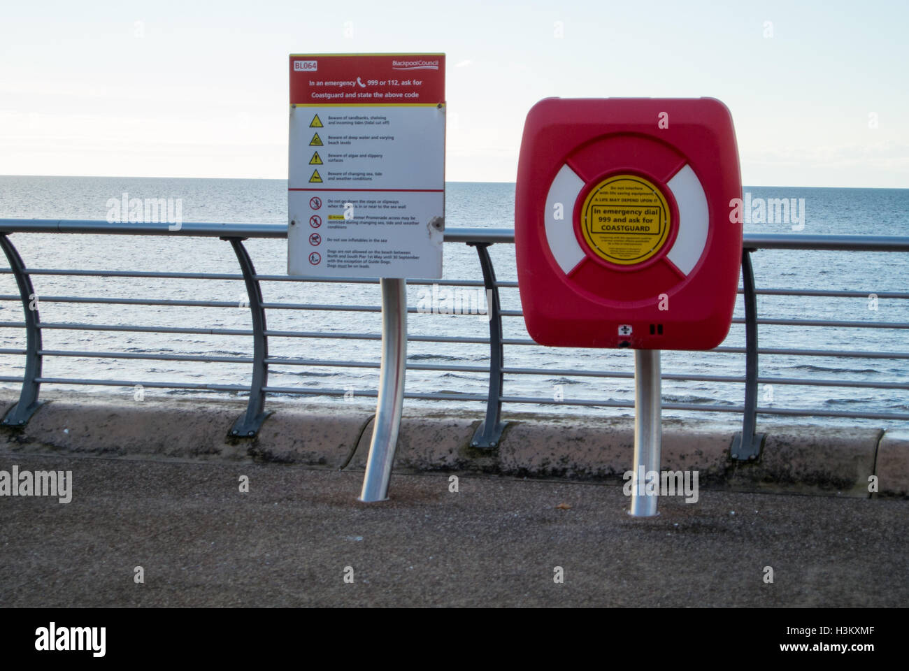 Life ring and warning sign on Blackpool promenade Stock Photo - Alamy